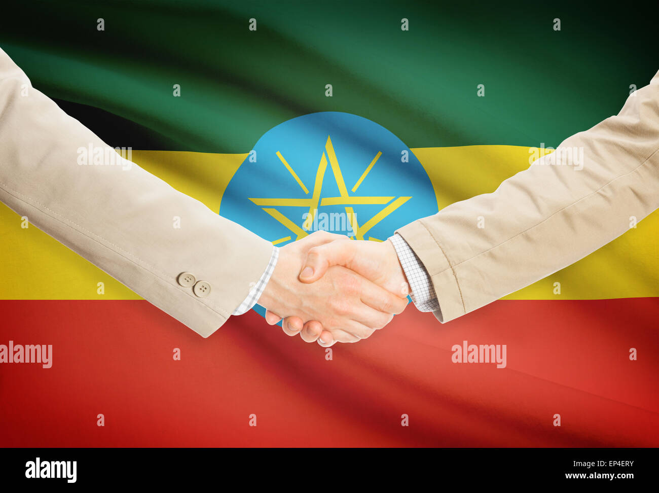Businessmen shaking hands with flag on background - Ethiopia Stock ...