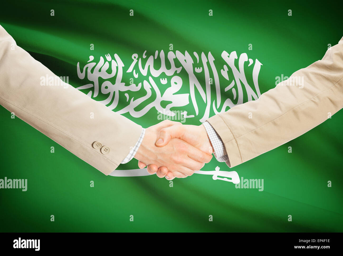 Businessmen shaking hands with flag on background - Saudi Arabia Stock ...
