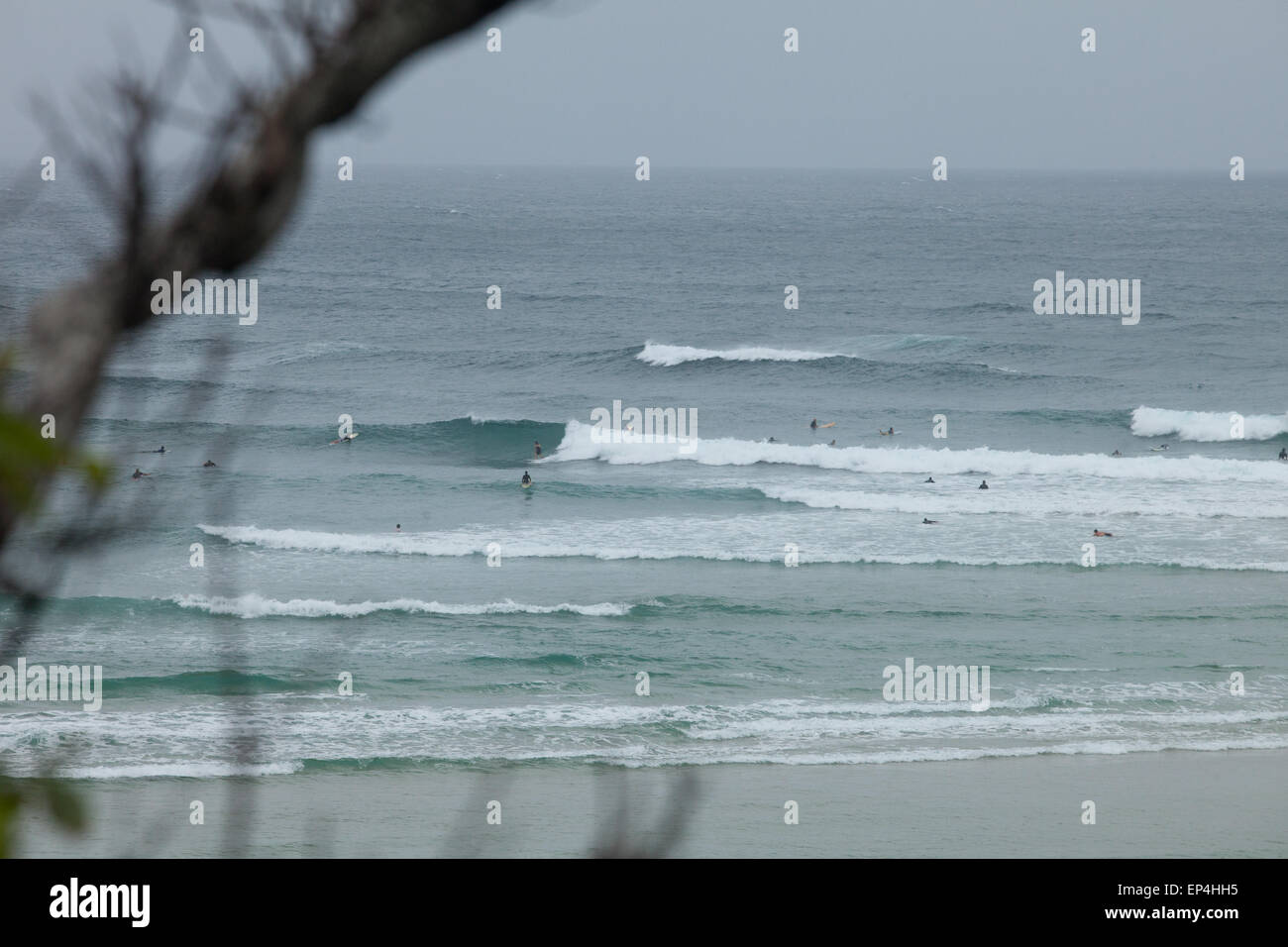 Surfers catching waves left and right at a popular surf break in Byron ...