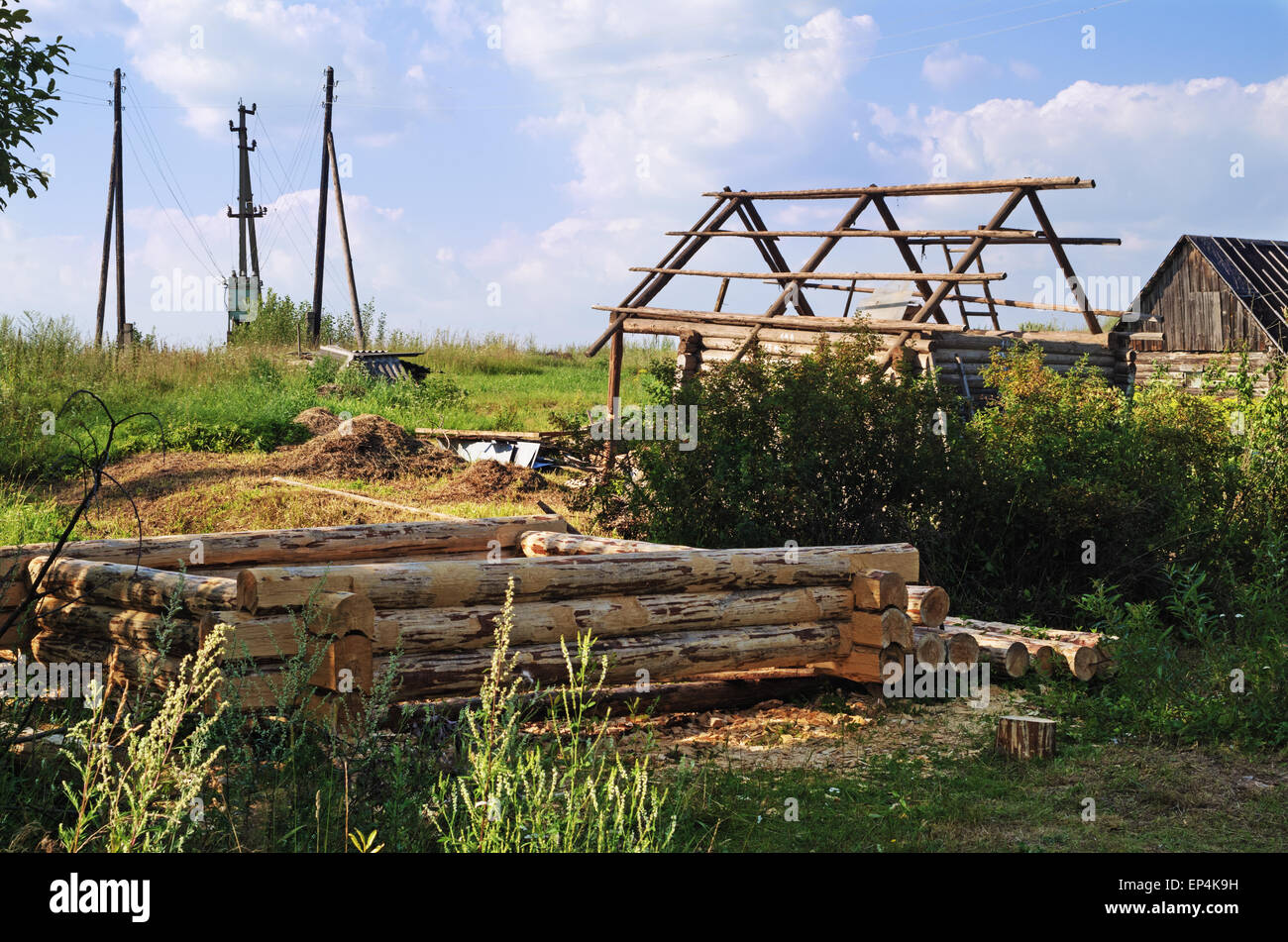 Village landscape with log-house Stock Photo - Alamy