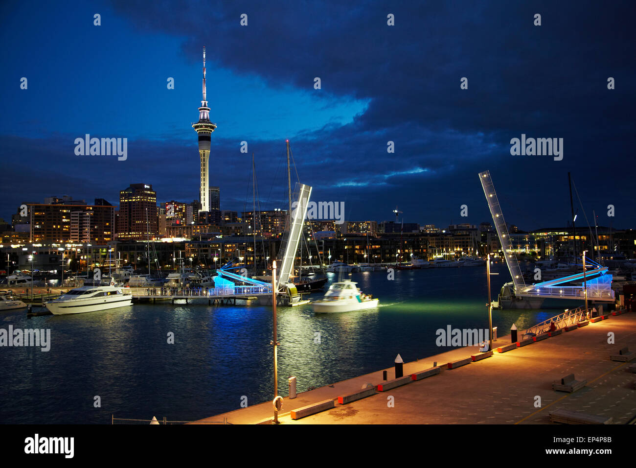 Wynyard Crossing bridge, and Skytower, Auckland waterfront, North ...