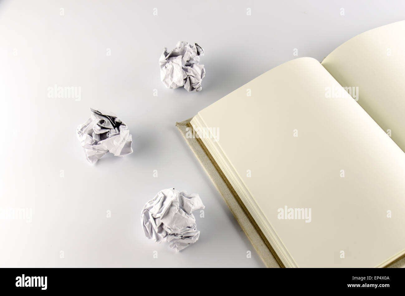 crumpled paper and notebook on a white background Stock Photo - Alamy