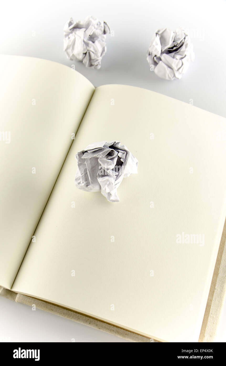 crumpled paper and notebook on a white background Stock Photo - Alamy