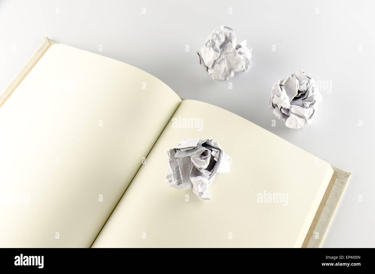crumpled paper and notebook on a white background Stock Photo - Alamy