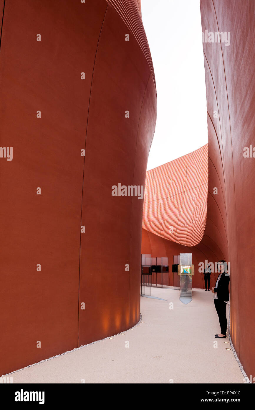Narrow pedestrian walkway flanked by undulating walls. Milan Expo 2015 ...