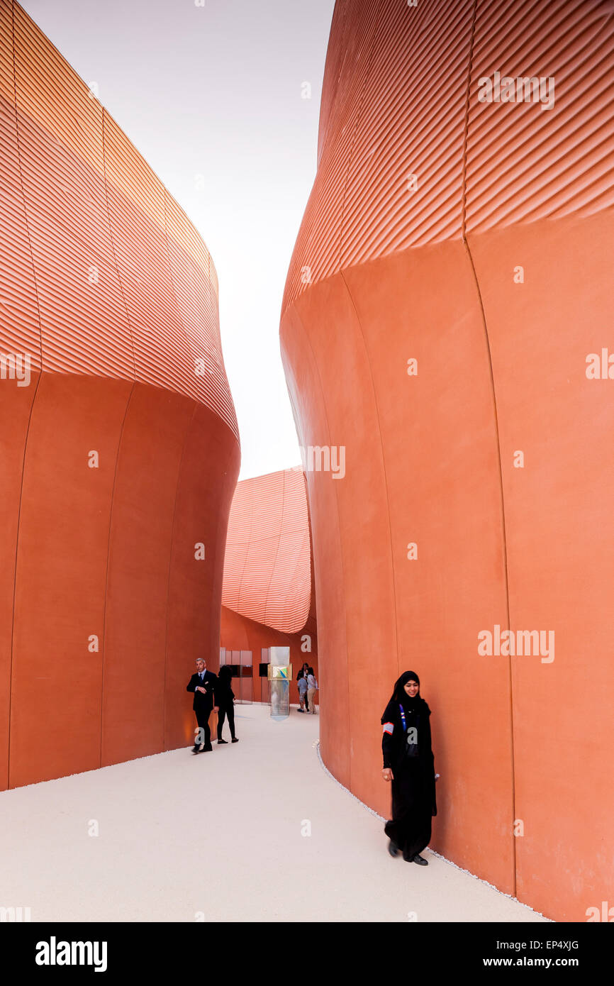 Narrow pedestrian walkway flanked by undulating walls. Milan Expo 2015 ...