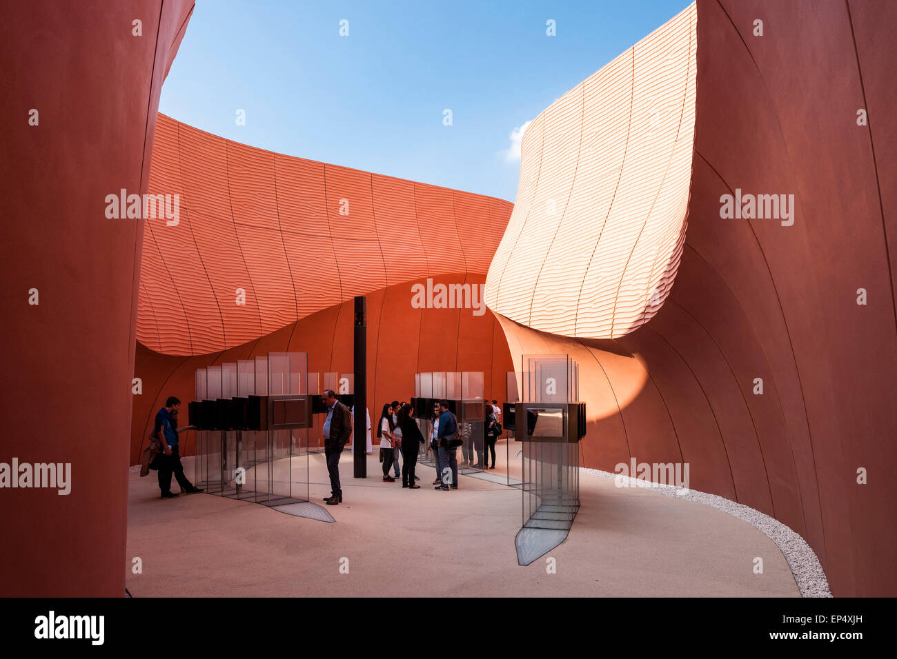 Exterior exhibition courtyard flanked by undulating walls. Milan Expo ...