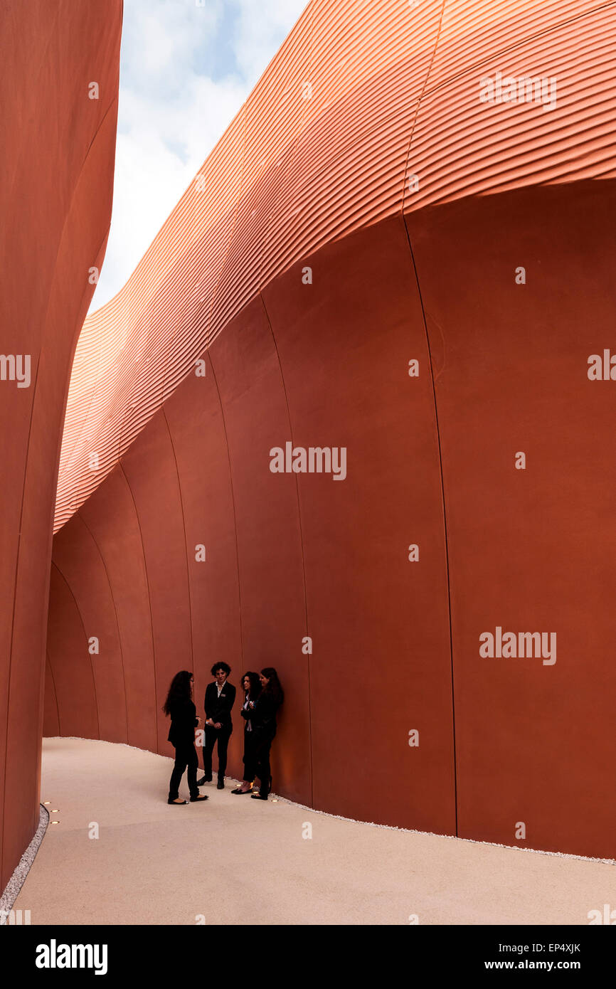 Narrow pedestrian walkway flanked by undulating walls. Milan Expo 2015 ...