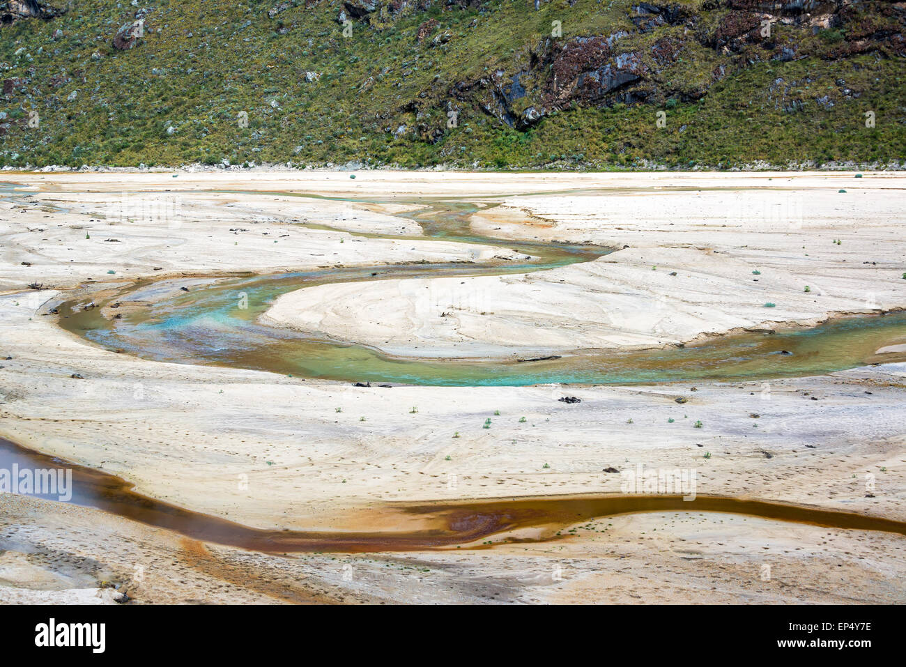 Small stream winding through the Cordillera Blanca in the Andes ...