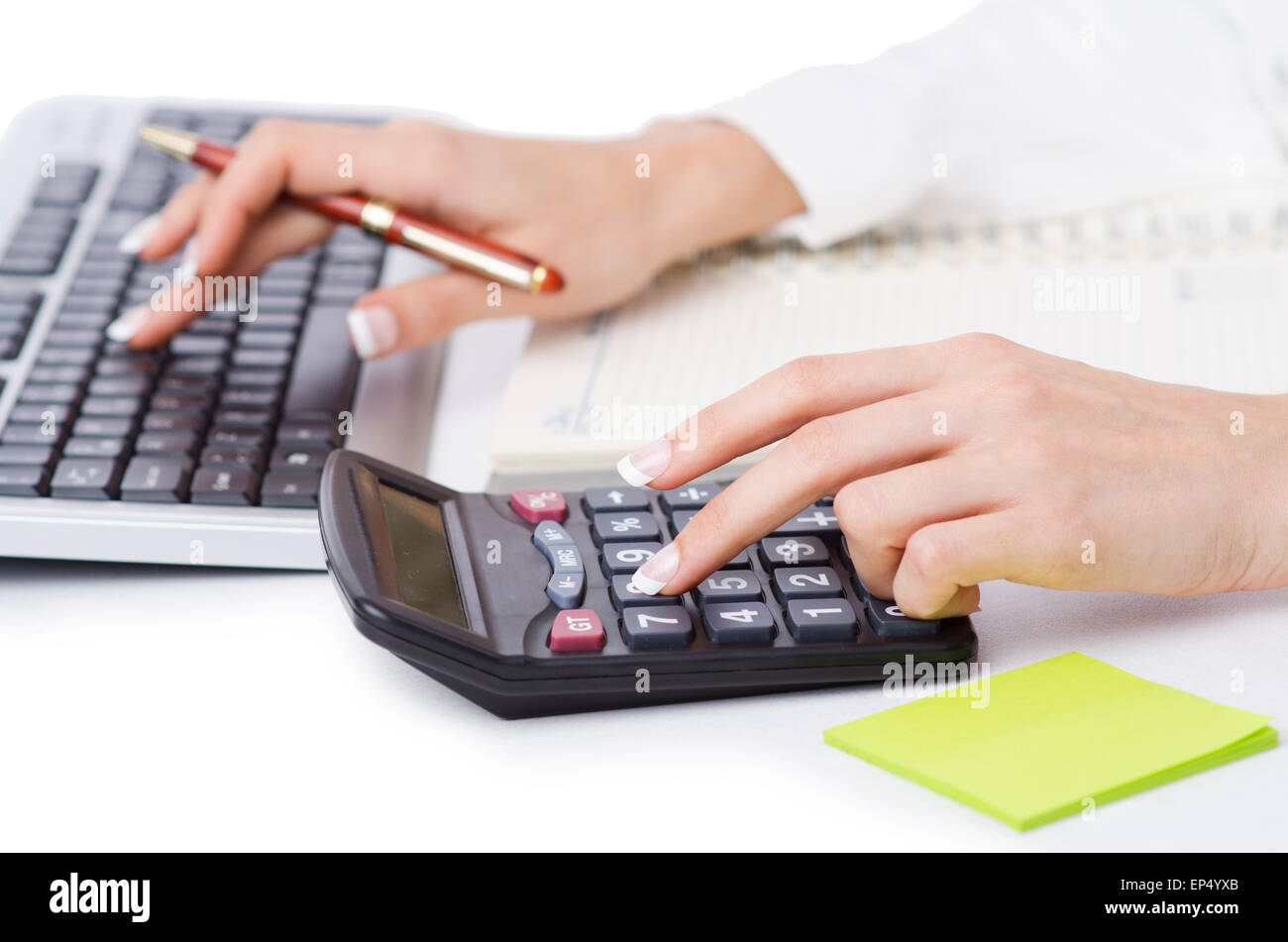 Hands working on the calculator Stock Photo - Alamy