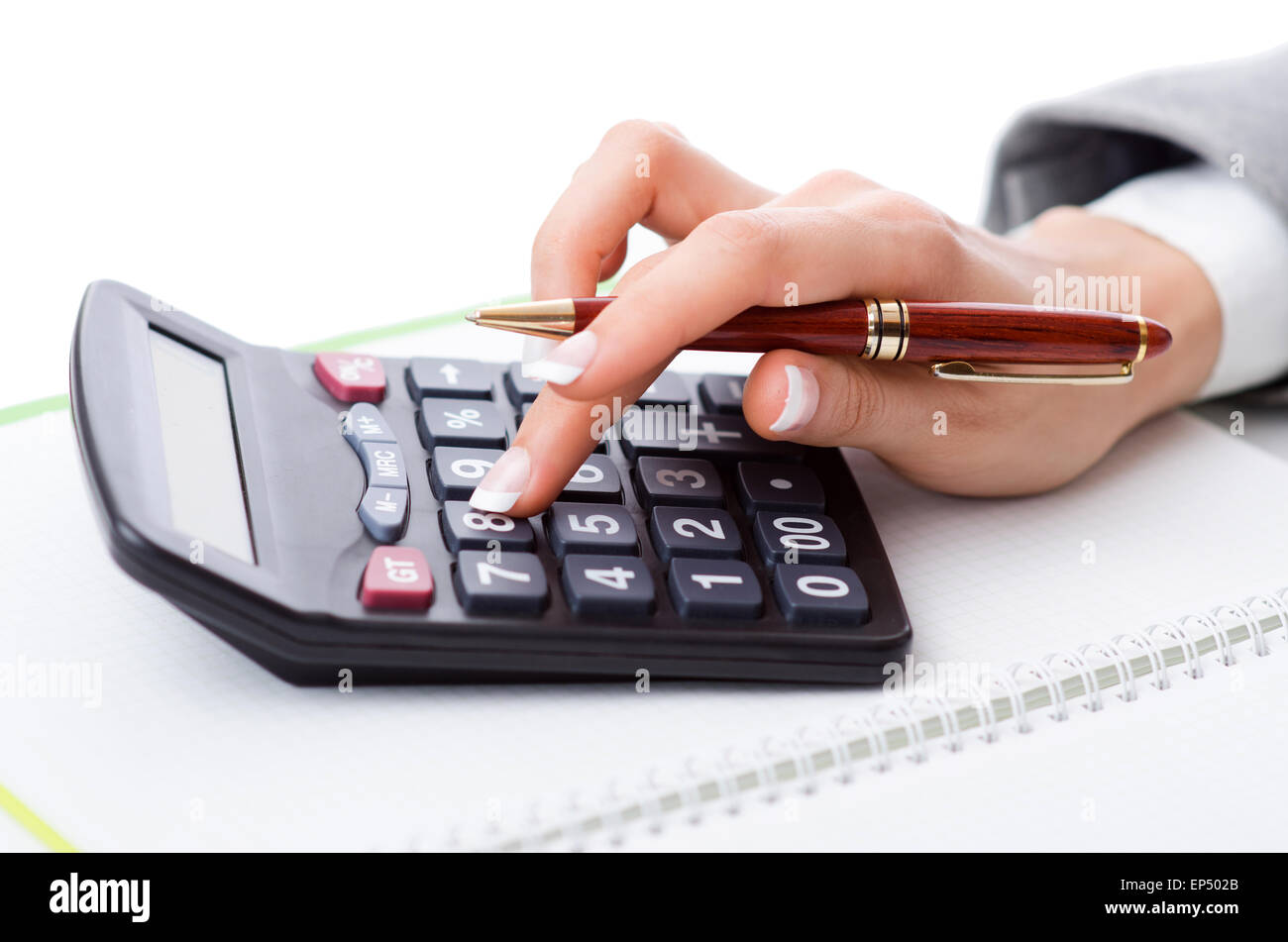 Hands working on the calculator Stock Photo - Alamy