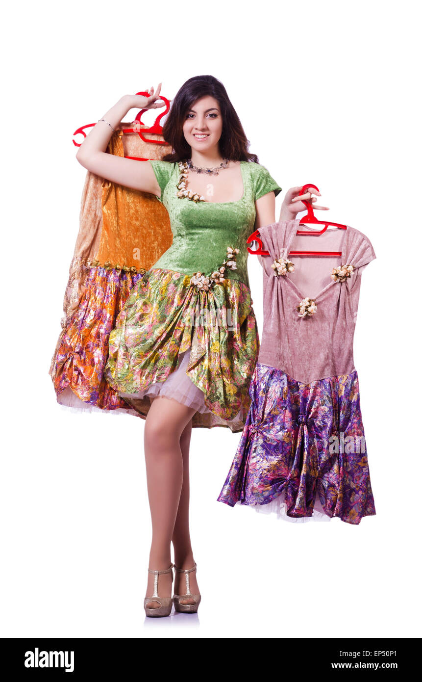 Woman trying to choose dress on white Stock Photo - Alamy