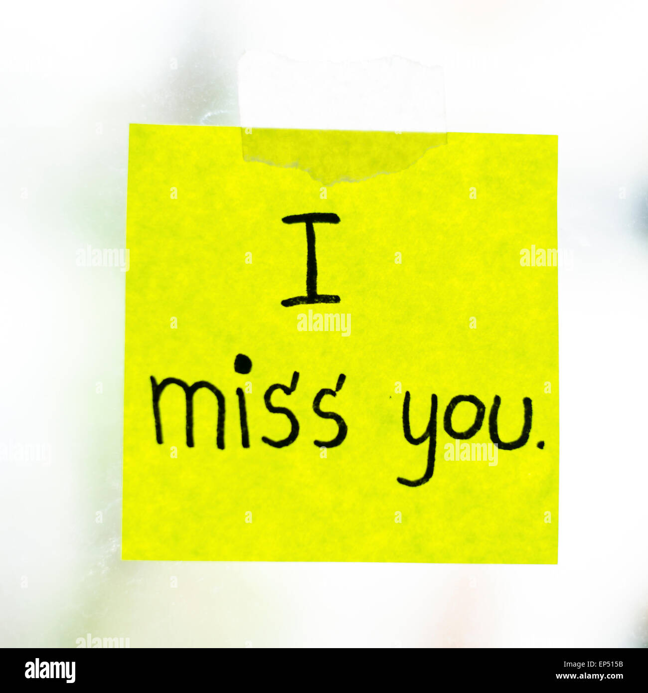 I miss you word sticky note on window mirror Stock Photo - Alamy