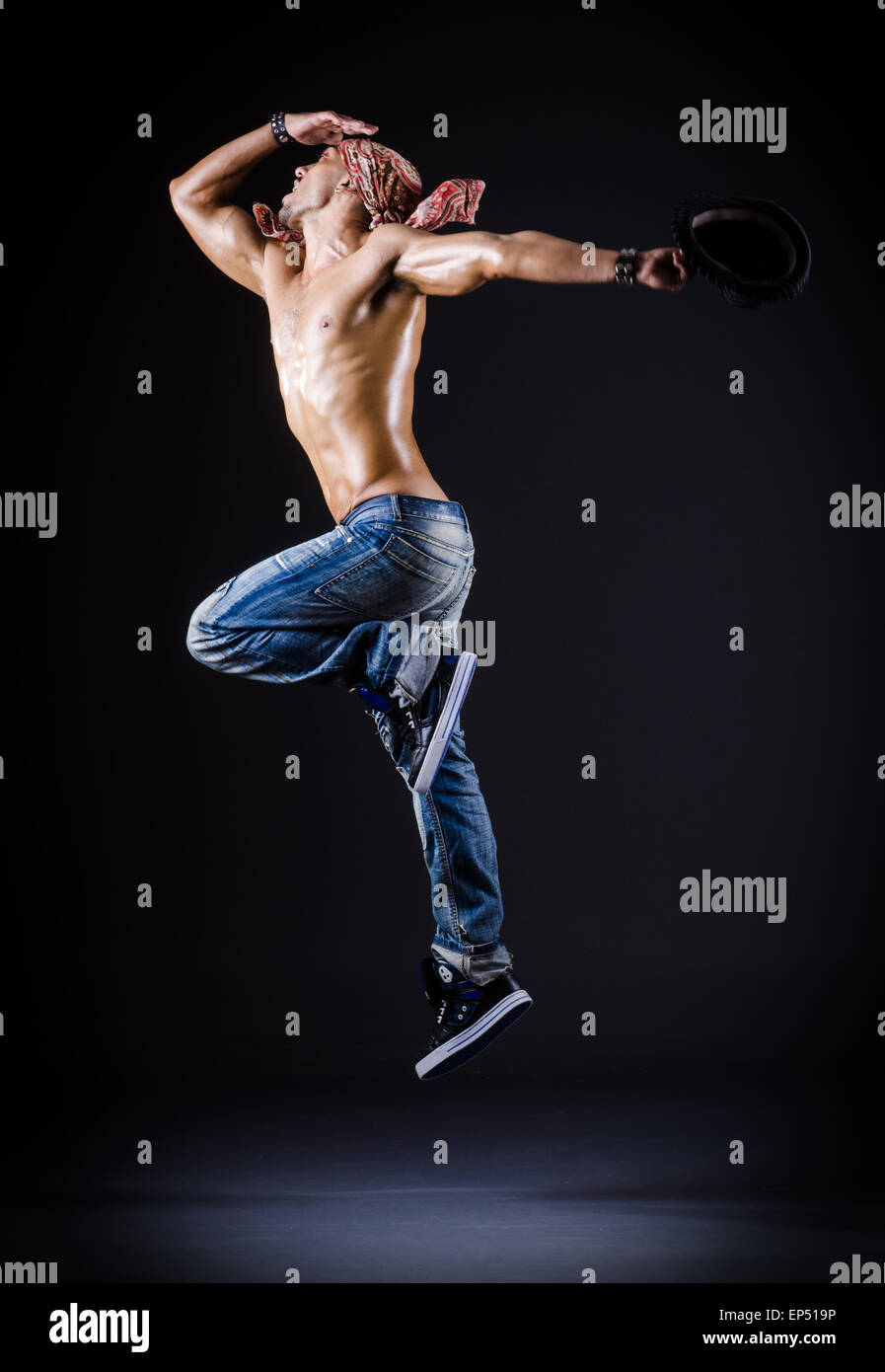 Dancer dancing in the dark studio Stock Photo - Alamy