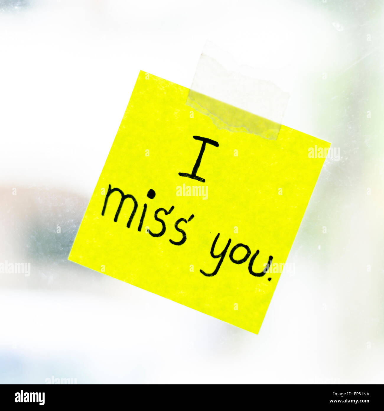 I miss you word sticky note on window mirror Stock Photo - Alamy