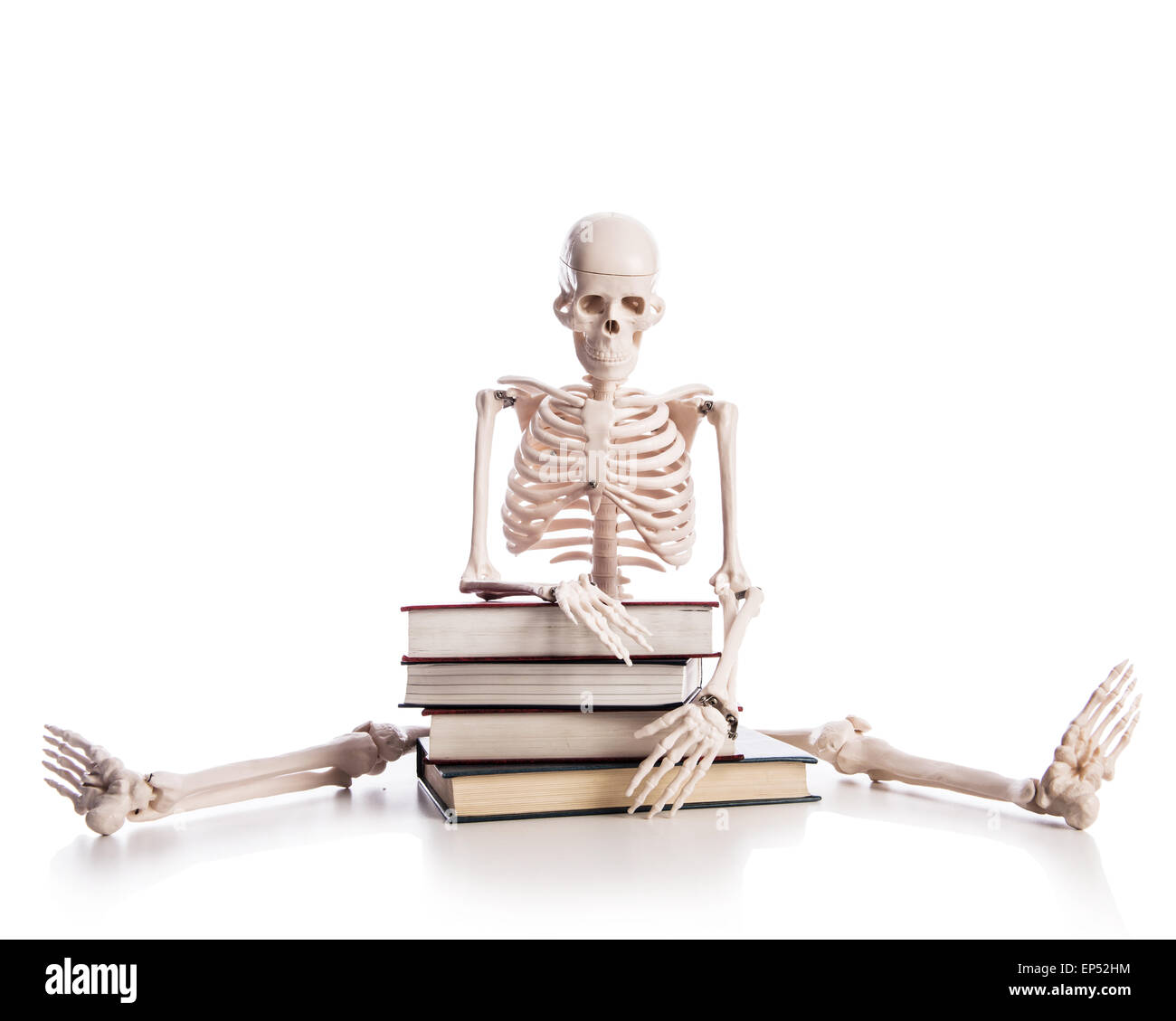 Skeleton with books isolated on white Stock Photo - Alamy