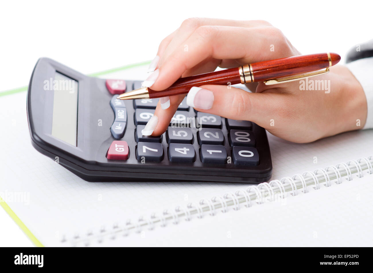 Hands working on the calculator Stock Photo - Alamy