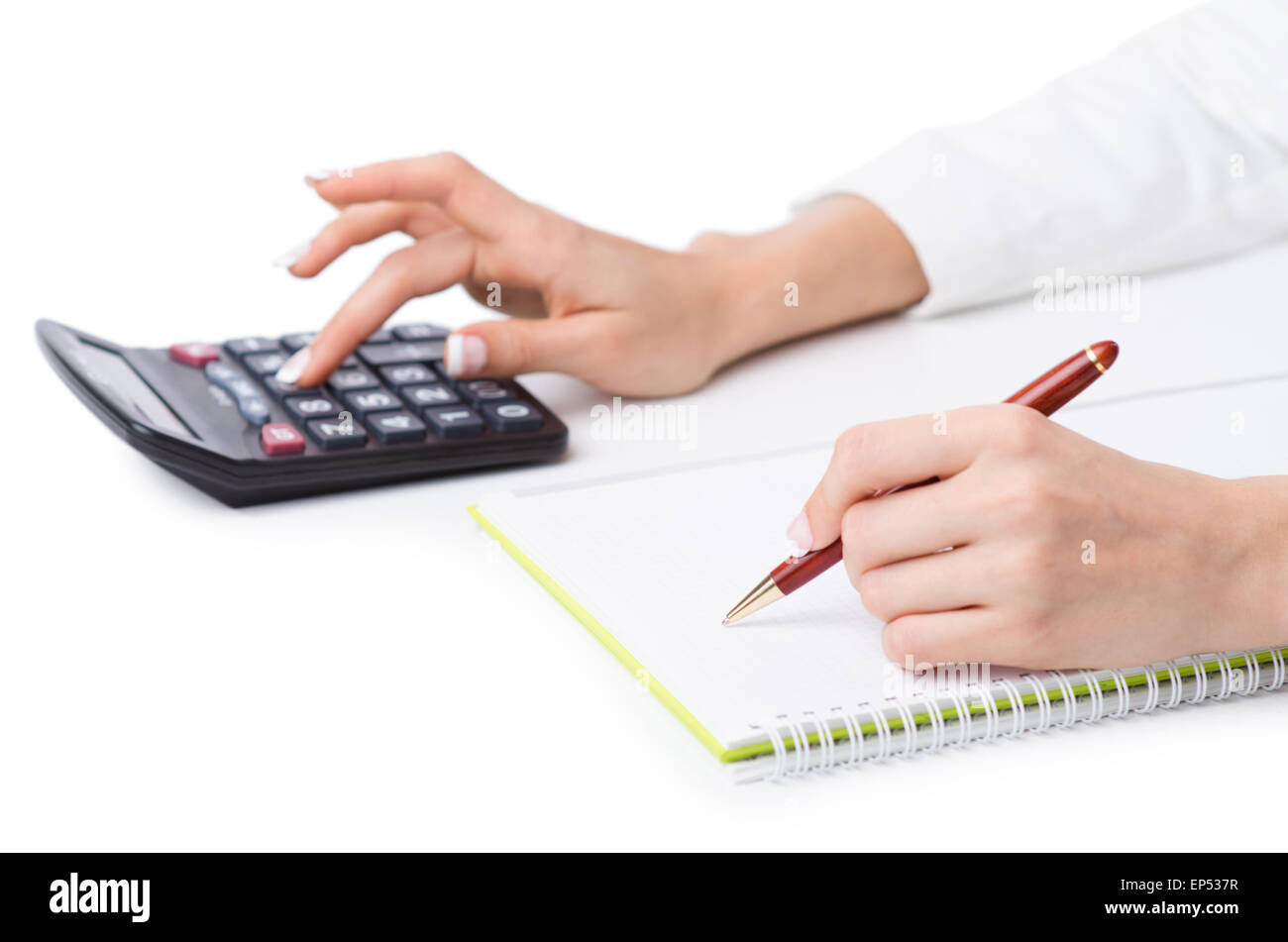 Hands working on the calculator Stock Photo - Alamy