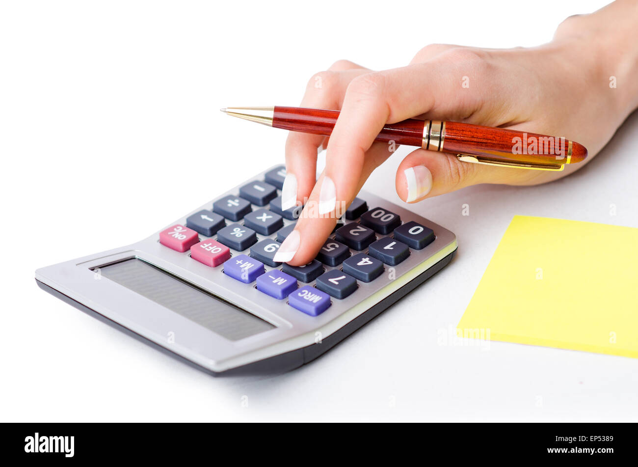 Hands working on the calculator Stock Photo - Alamy