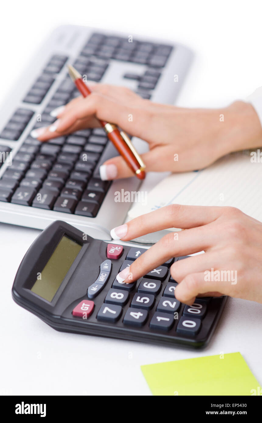 Hands working on the calculator Stock Photo - Alamy