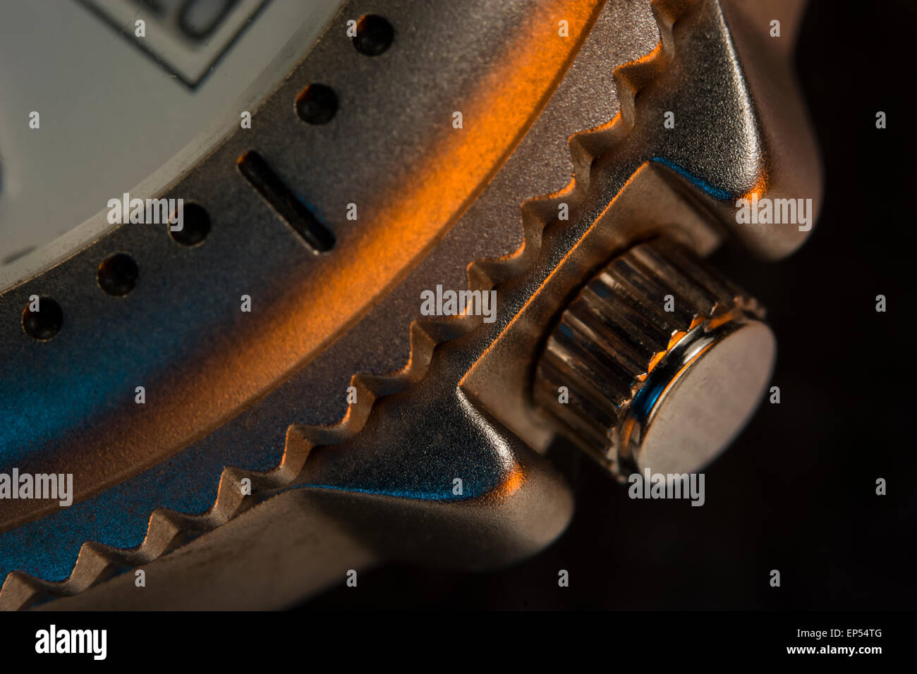 Macro-photo of watch winder. Beat the clock metaphor Stock Photo - Alamy