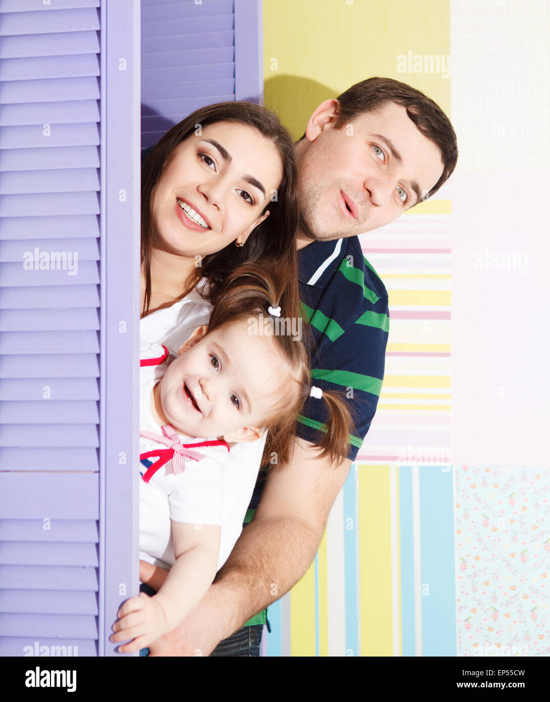Happy smiling family with one year old baby girl Stock Photo - Alamy Happy smiling family with one year old baby girl Stock Photo - Alamy