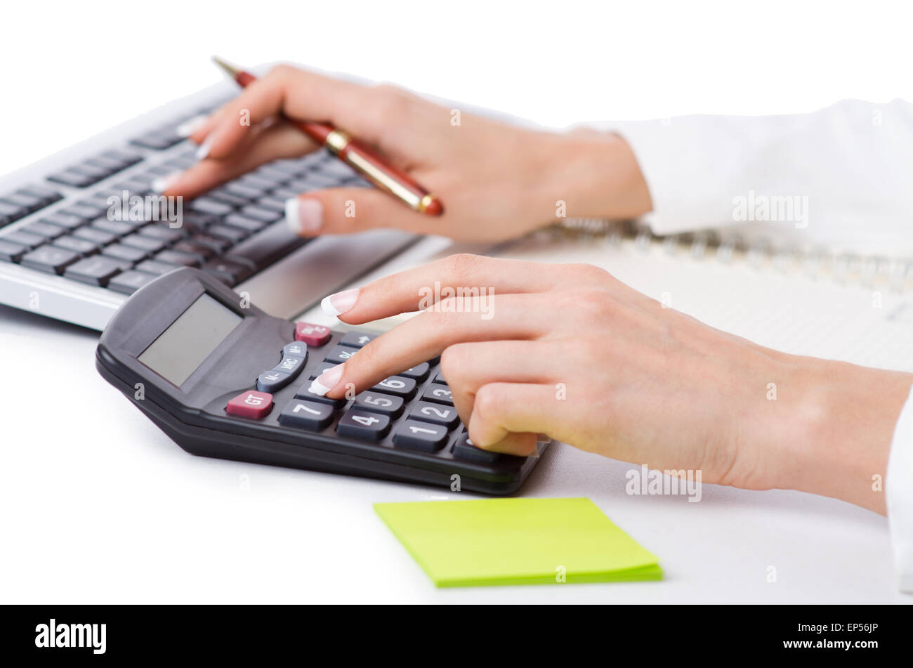 Hands working on the calculator Stock Photo - Alamy