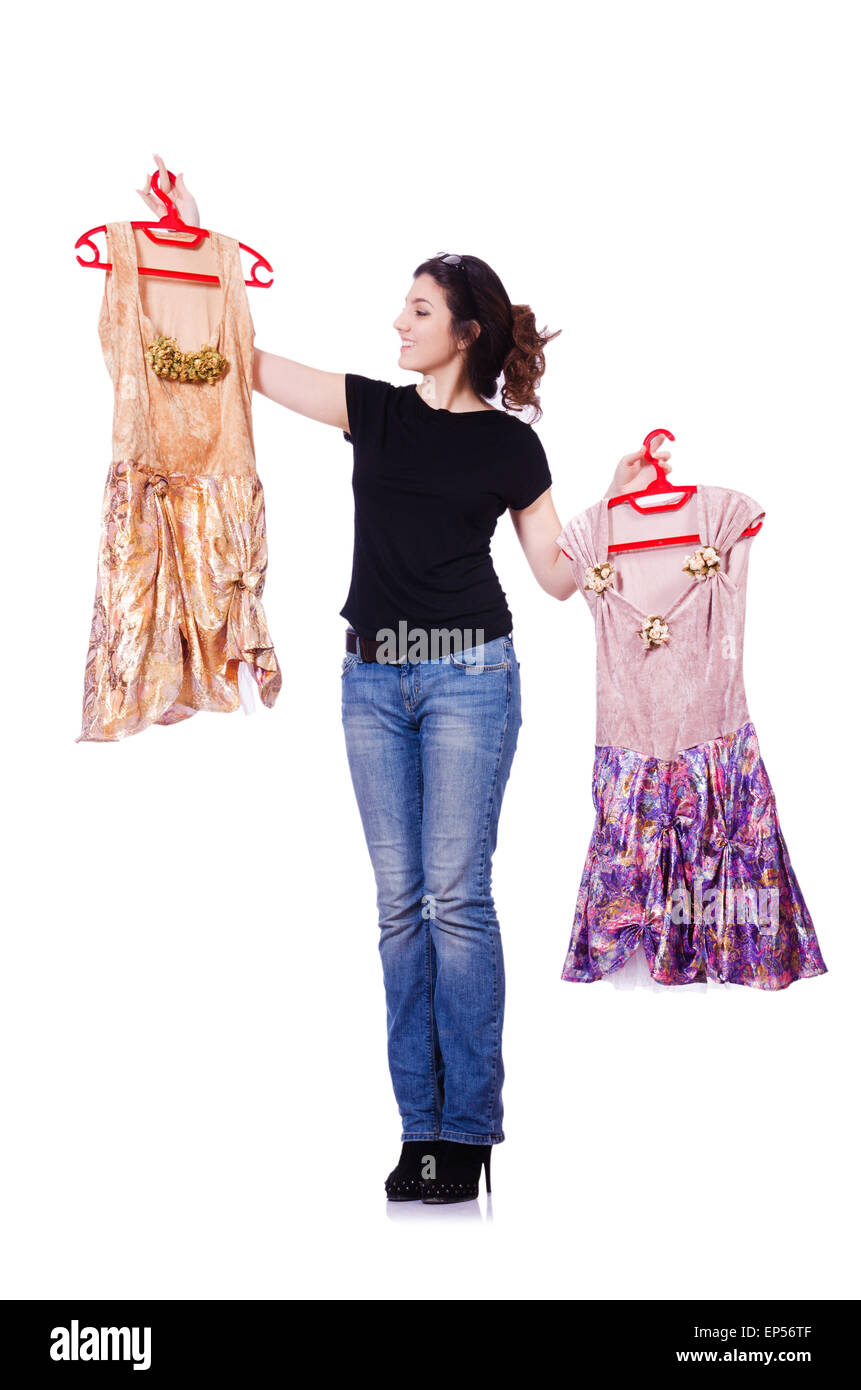 Woman trying to choose dress on white Stock Photo - Alamy