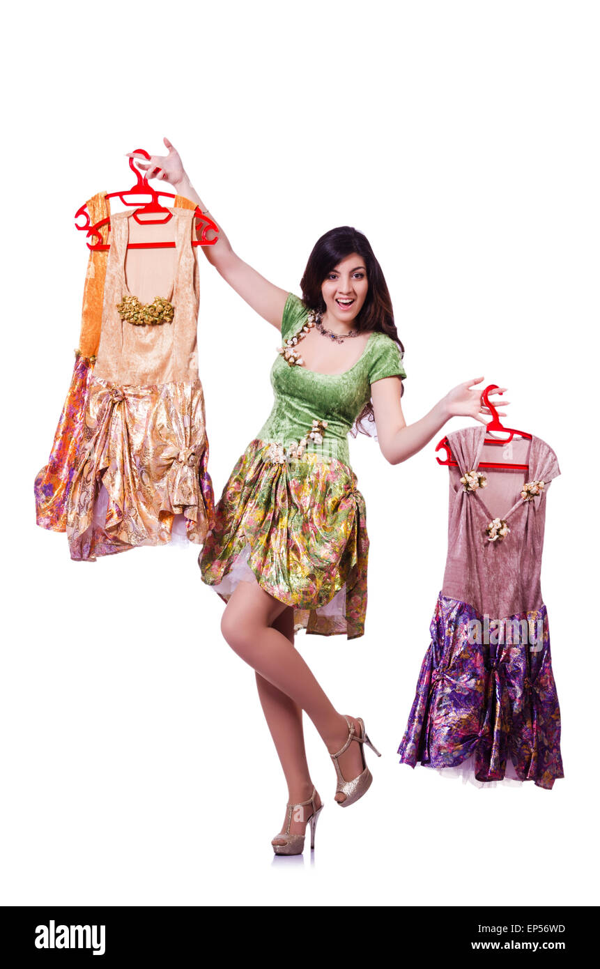 Woman trying to choose dress on white Stock Photo - Alamy