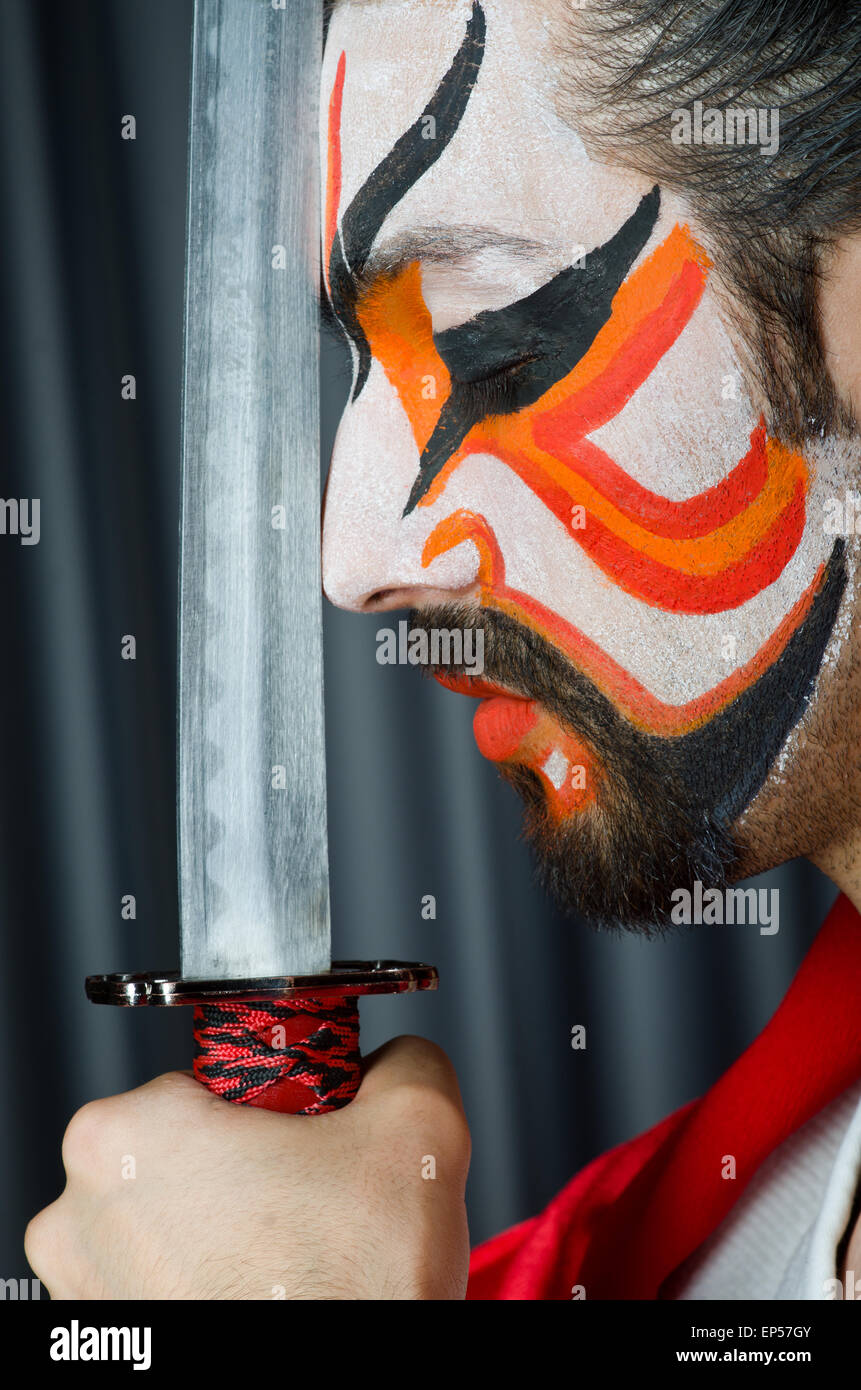 Man with sword and face mask Stock Photo - Alamy