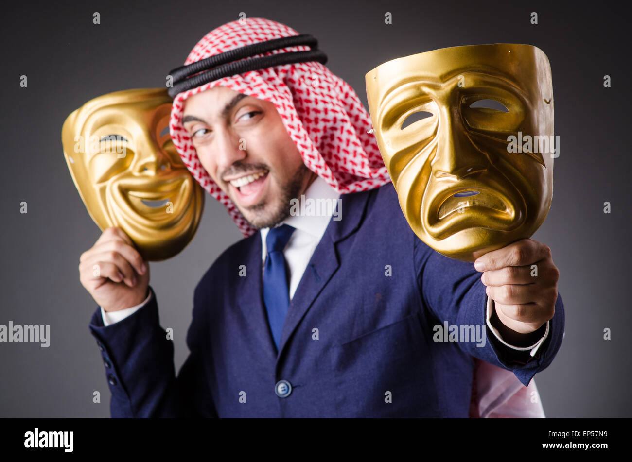 Arab with masks in dark studio Stock Photo - Alamy