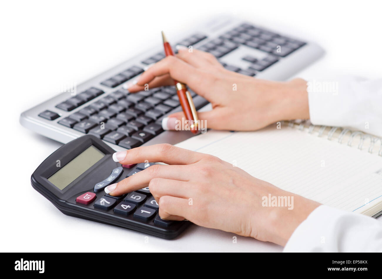 Hands working on the calculator Stock Photo - Alamy