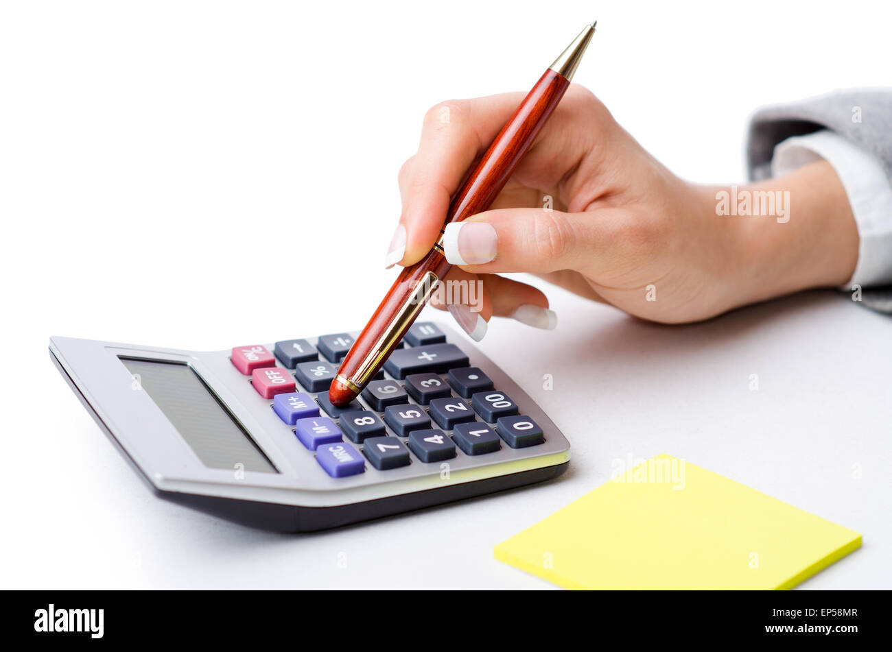 Hands working on the calculator Stock Photo - Alamy