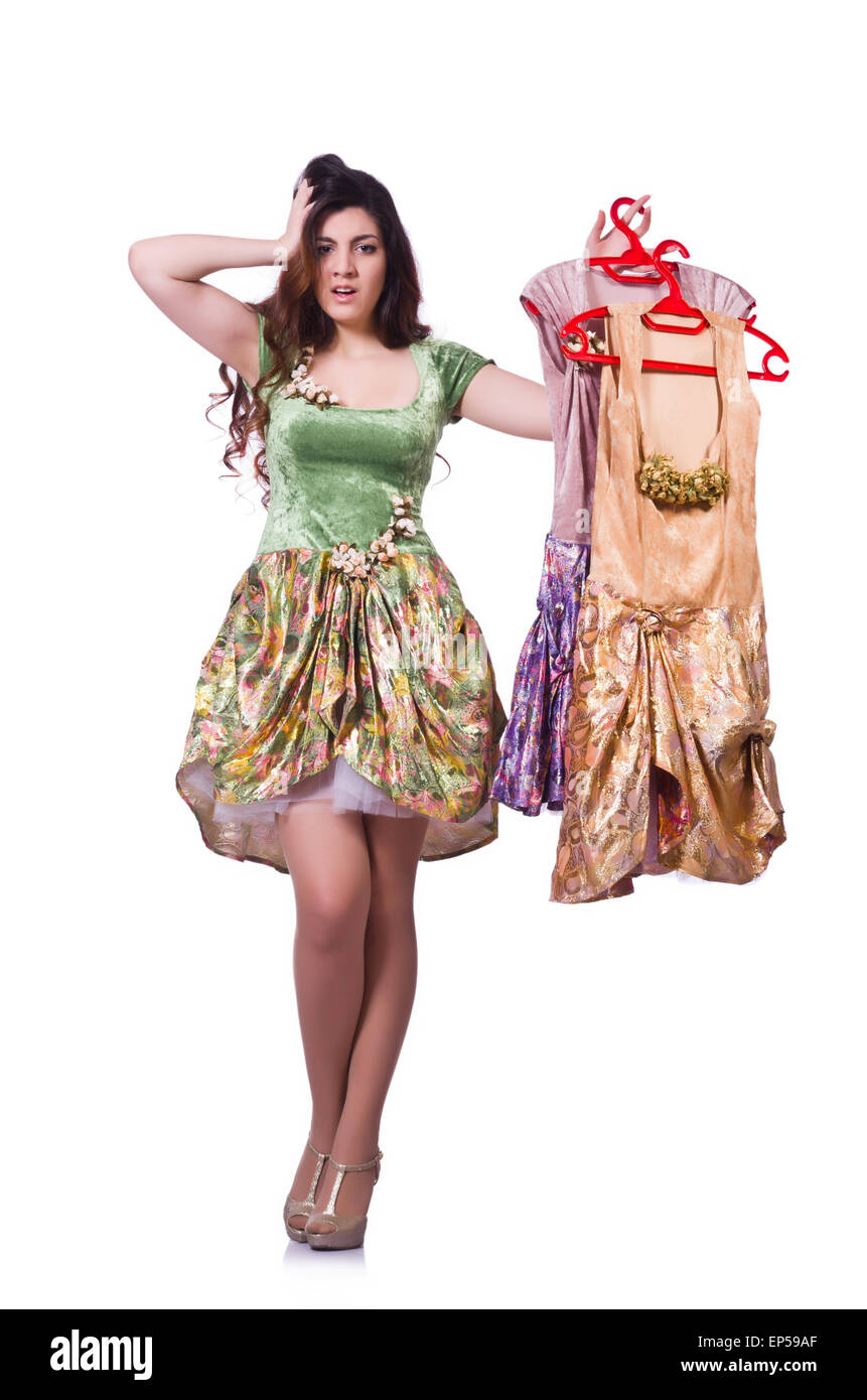 Woman trying to choose dress on white Stock Photo - Alamy