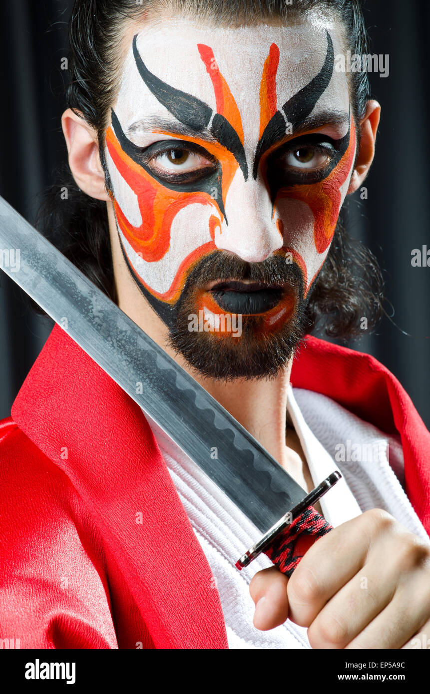 Man with sword and face mask Stock Photo - Alamy