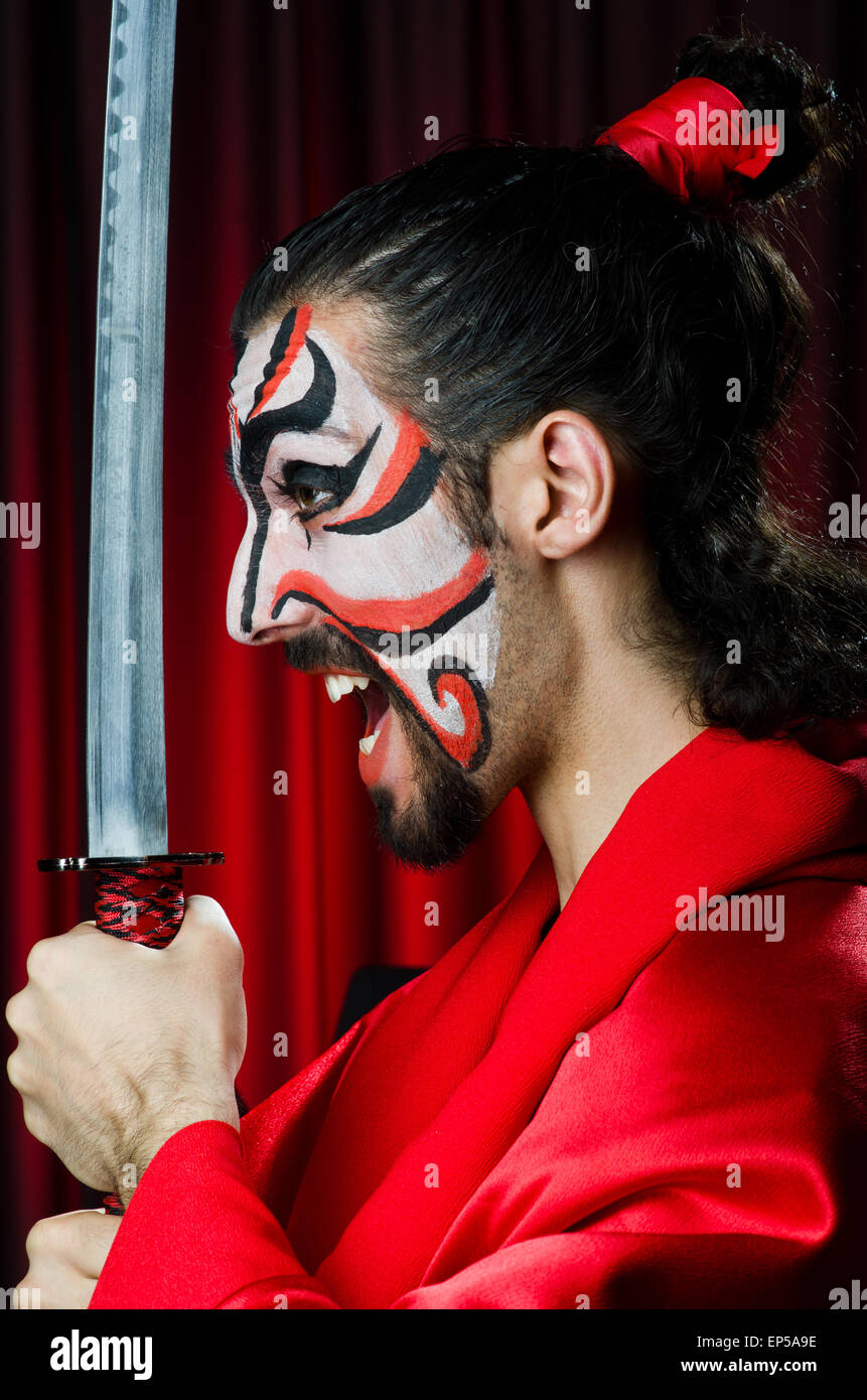 Man with sword and face mask Stock Photo - Alamy