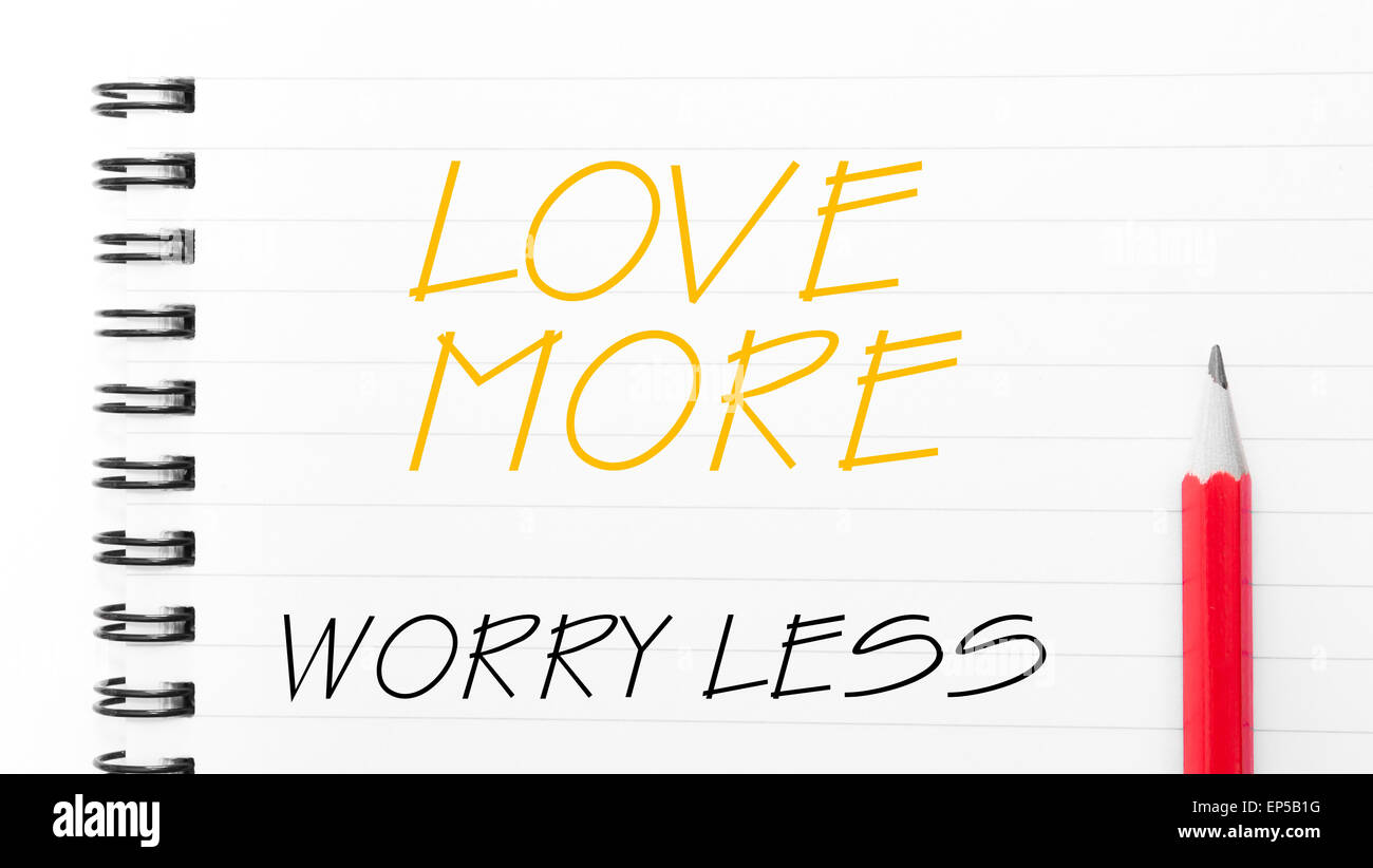 Love More Worry Less Text written on notebook page, red pencil on the ...