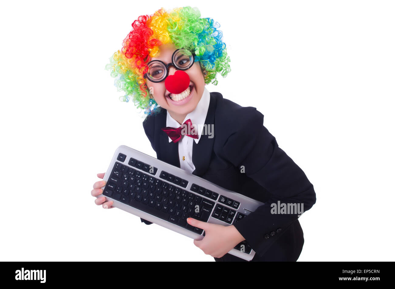 Funny clown with keyboard on white Stock Photo - Alamy