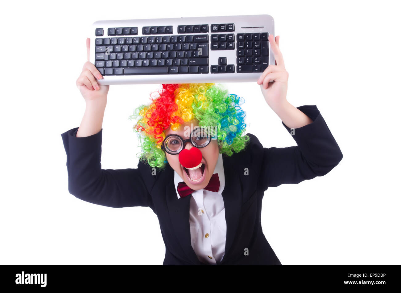 Funny clown with keyboard on white Stock Photo - Alamy