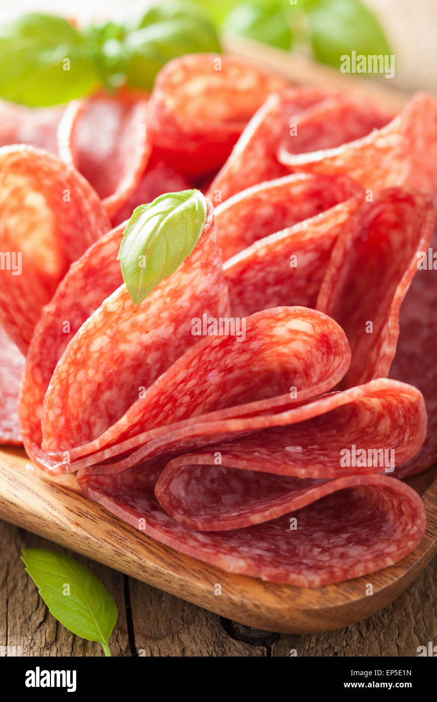 salami slices in wooden plate Stock Photo - Alamy