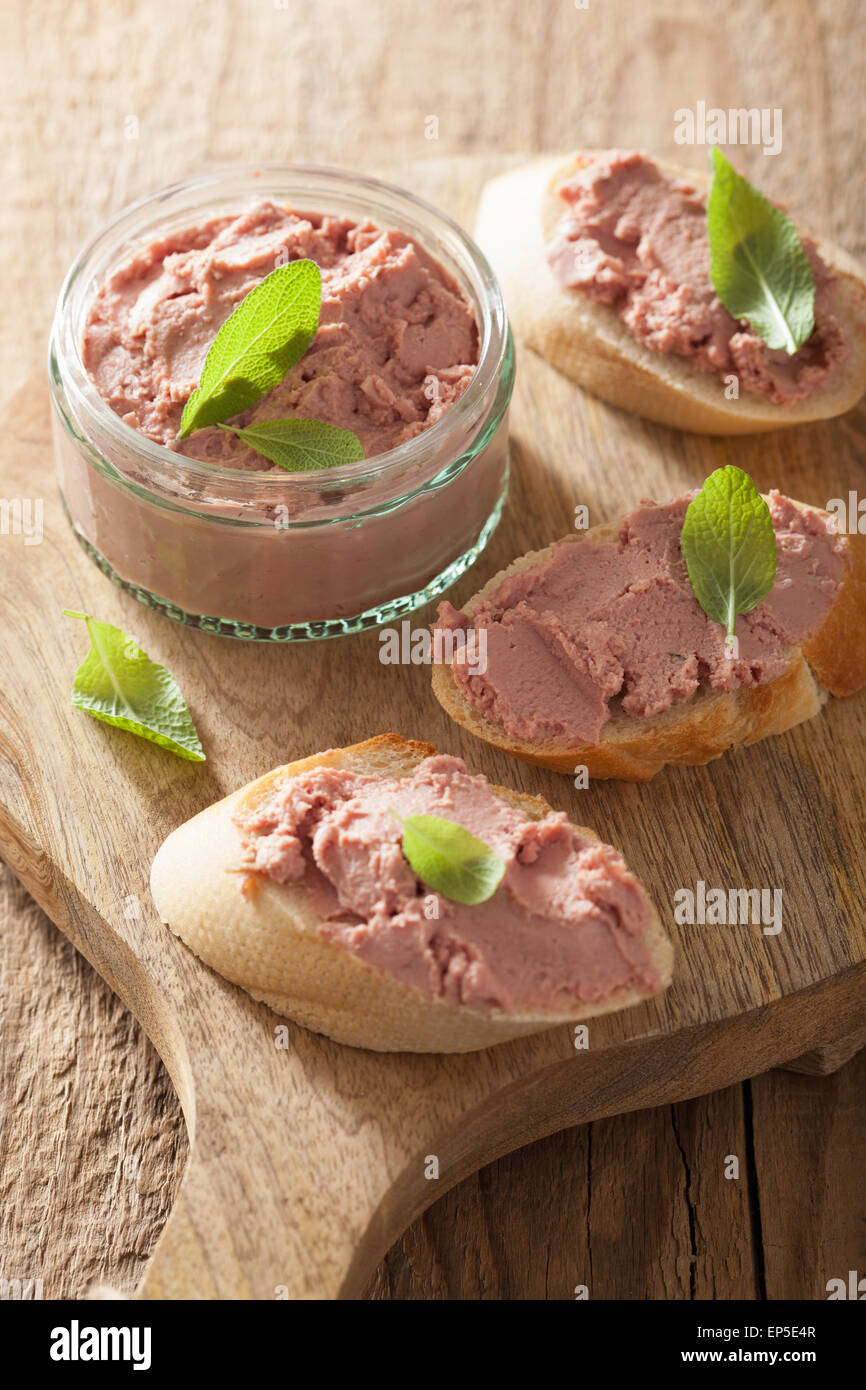 healthy chicken liver pate with sage in jar and on bread Stock Photo ...