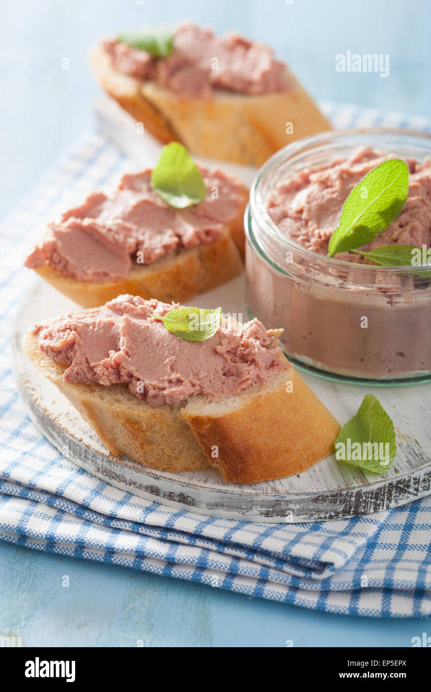 healthy chicken liver pate with sage in jar and on bread Stock Photo ...