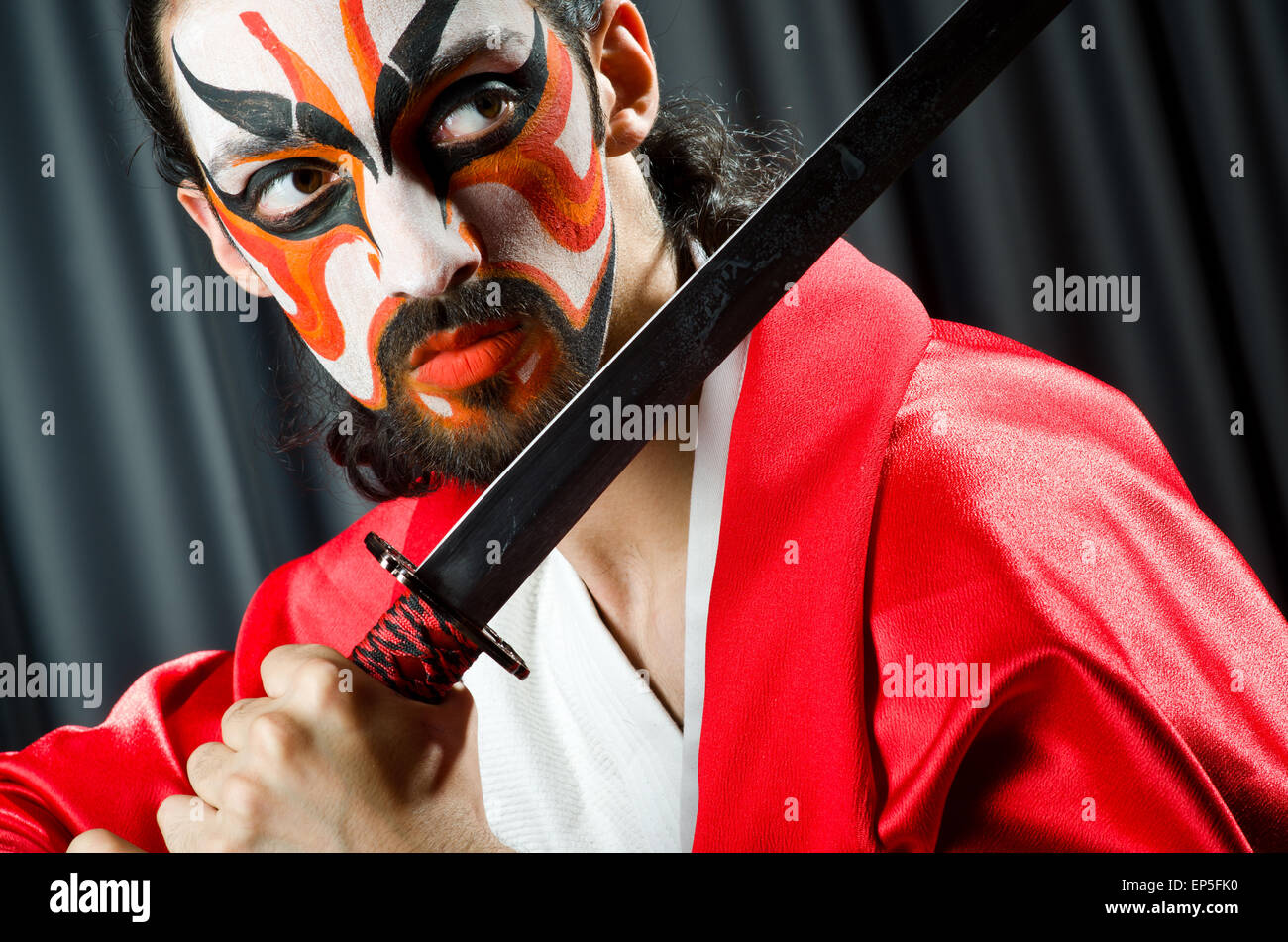 Man with sword and face mask Stock Photo - Alamy