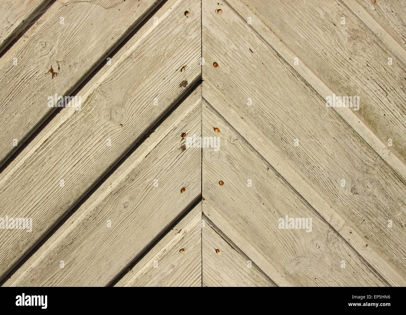 Handcrafted door plank lines with nails forming angle Stock Photo - Alamy