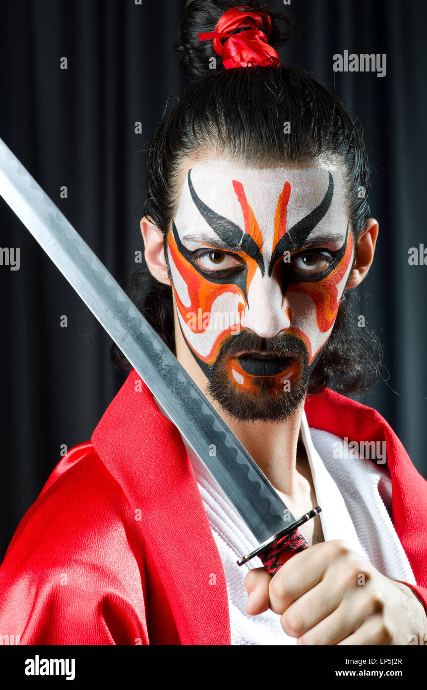 Man with sword and face mask Stock Photo - Alamy