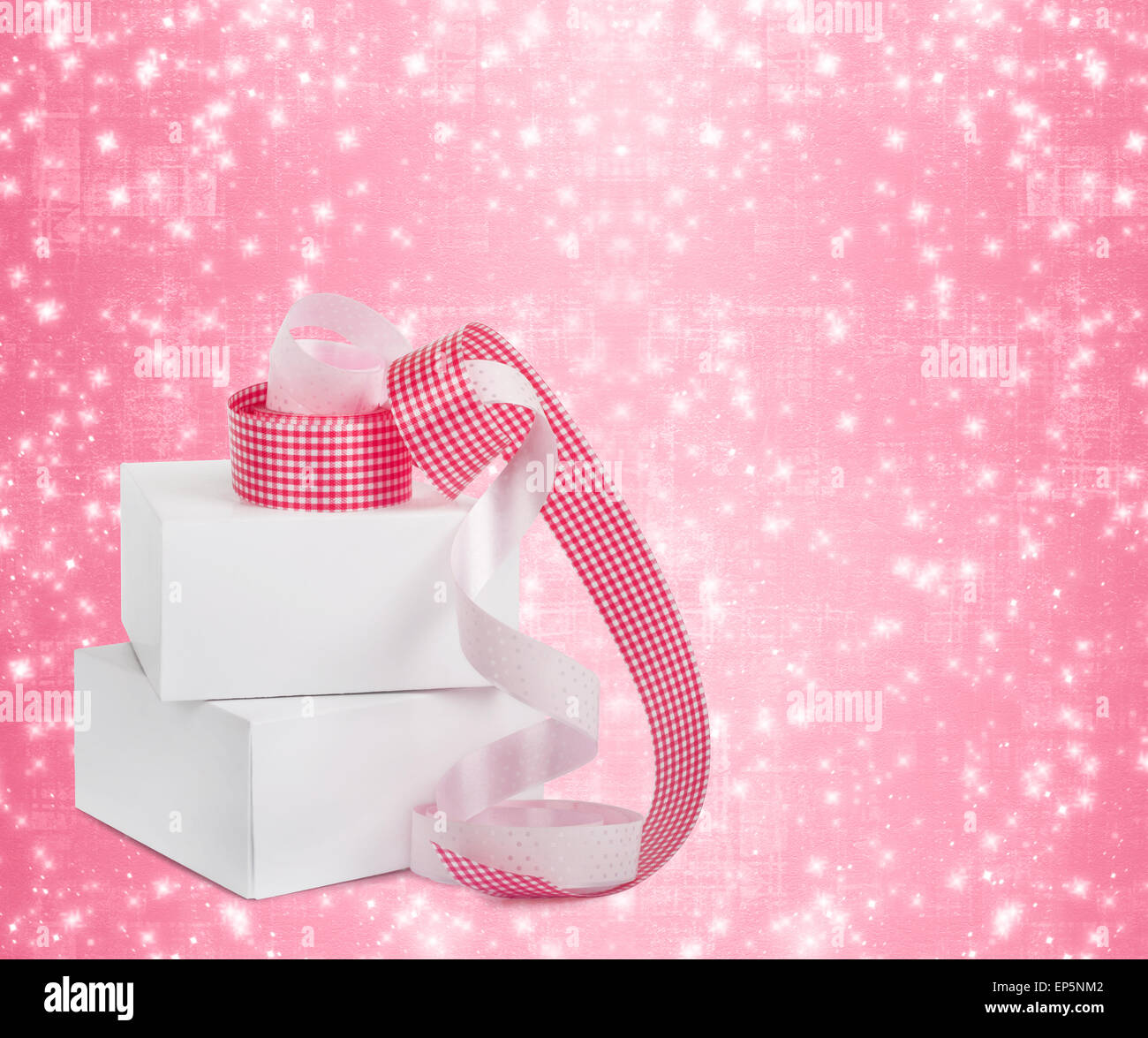 White boxes with gifts with pink ribbons on the beautiful abstract ...