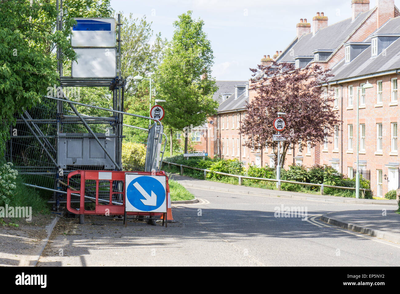 Slow-moving or stationary works vehicle blocking a traffic lane. Pass ...