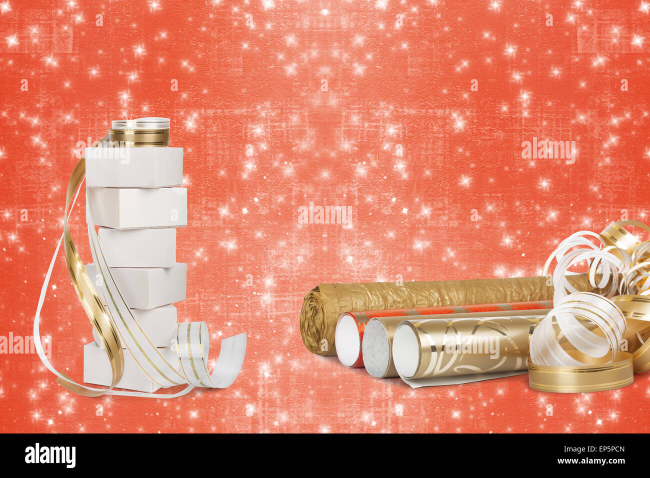 Gift boxes and rolls of wrapping paper with multicolored streamers for ...