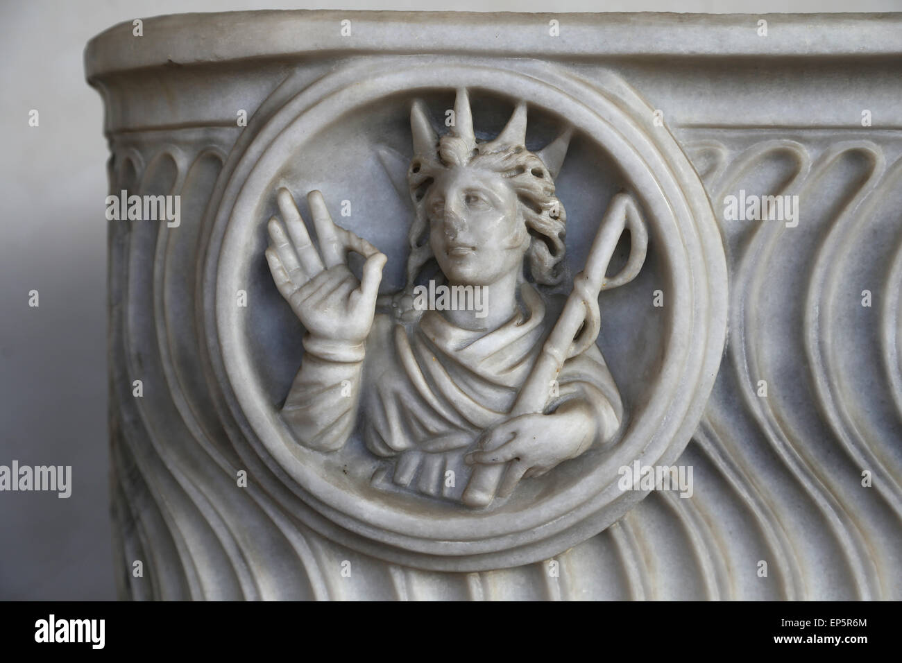 Roman sarcophagus. Strigillated. Bust of Helios (God-sun) in a clipeus ...