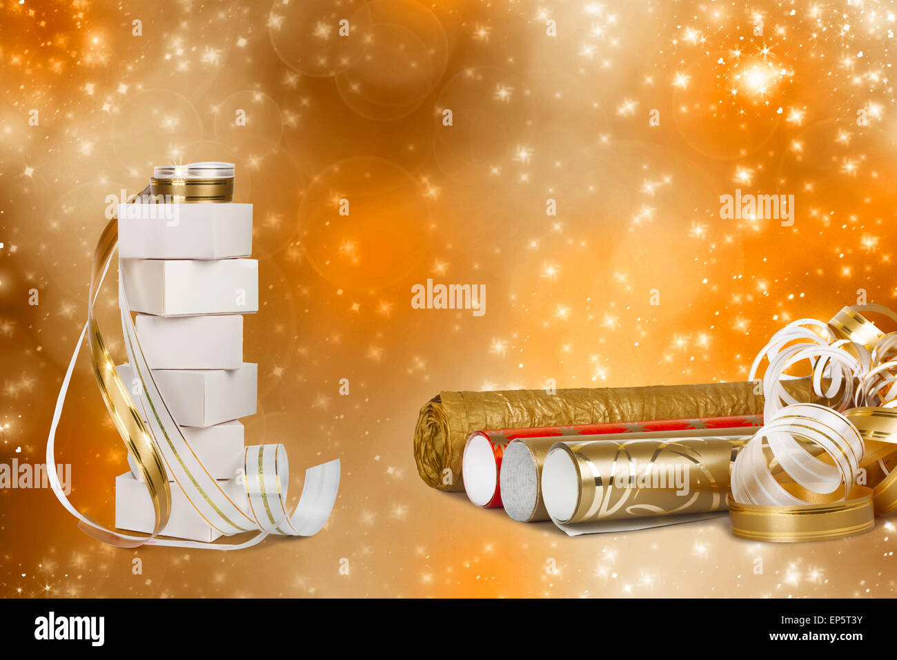 Gift boxes and rolls of wrapping paper with multicolored streamers for ...